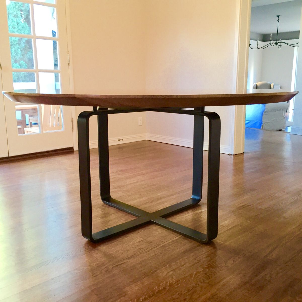 Custom Modern Round Walnut Dining Table by maneuverworks | CustomMade.com
